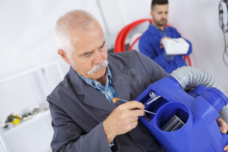 Repairman engineer at work stock image. Image of controlling - 172817685