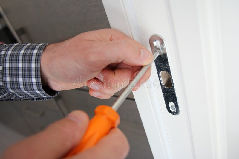 Repairman Fixing a Door Lock Stock Photo - Image of bathroom ...