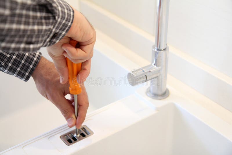 Repairman Fixing a Kitchen Sink Stock Image - Image of male, tool: 72161129