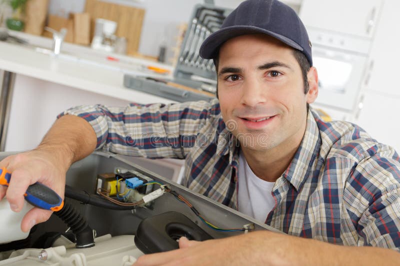 Repairman Fixing Washing Machine Stock Image - Image of happy, like ...