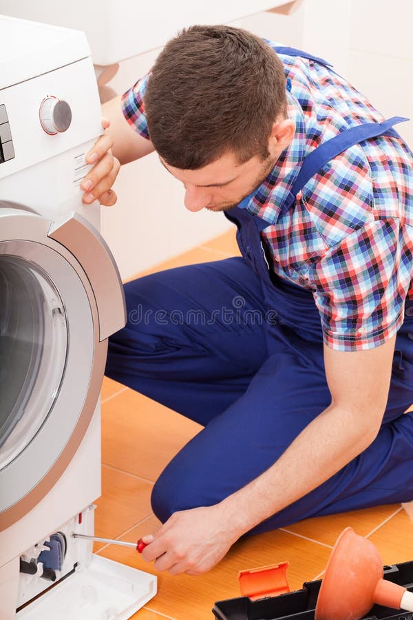 Man in the washing machine stock image. Image of male - 10251869