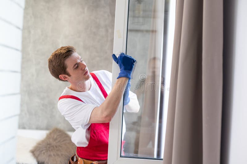 A Repairman Fixing Windows in New Apartment Stock Image - Image of ...