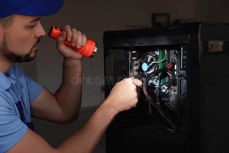 Repairman with Flashlight Fixing System Unit Indoors Stock Image ...