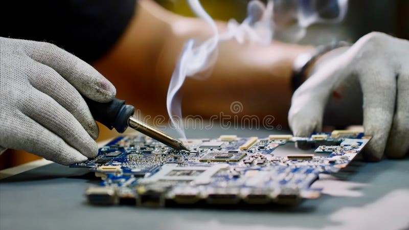 Repairman in Gloves is Soldering Motherboard of Computer Device in ...