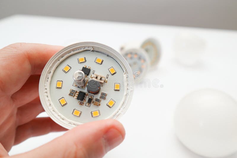 Repairman Hand Holding the Broken White LED Lamp, Isolated on White ...