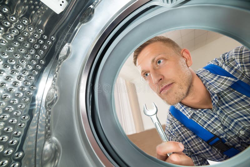Repairman Servicing Washing Machine Stock Photo - Image of maintenance ...