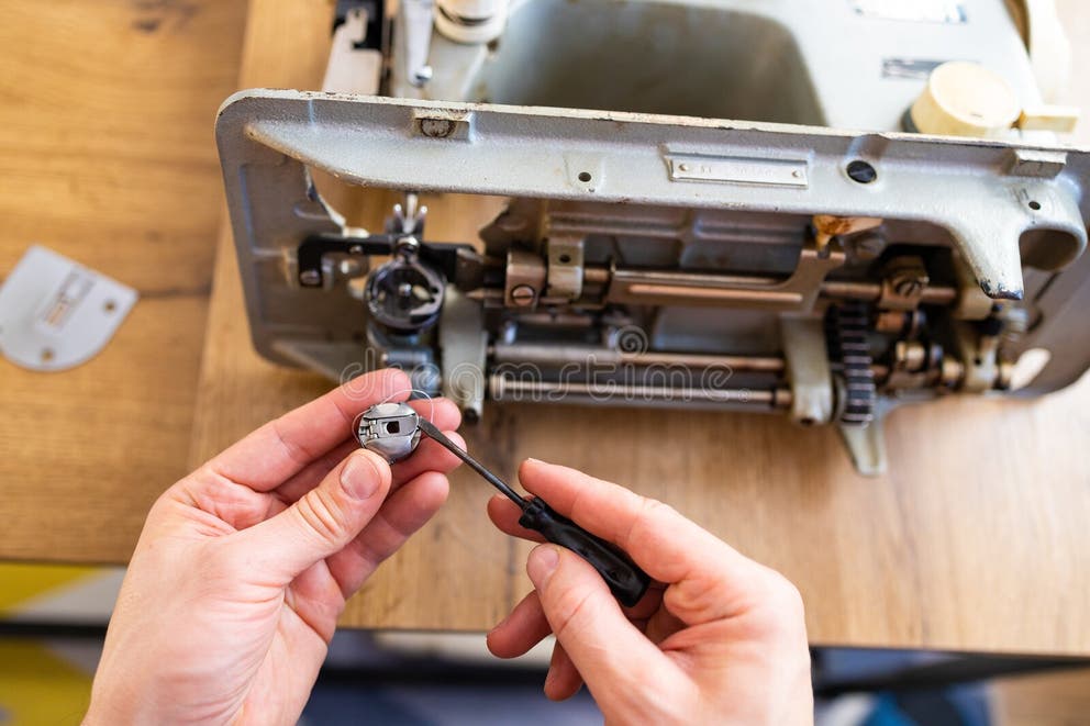Repairman Master is Testing Old Disassembles Sewing Machine in Workshop ...