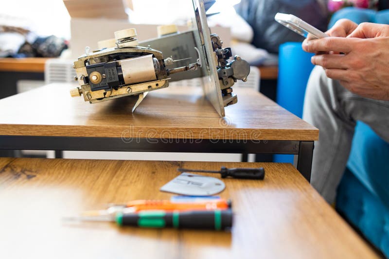 Repairman Master is Testing Old Disassembles Sewing Machine in Workshop ...
