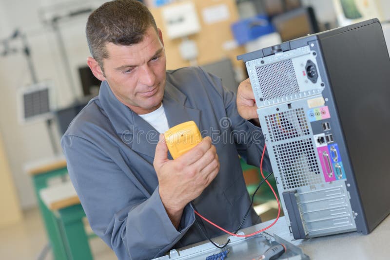 Repairman Testing Computer with Multimeter Stock Photo - Image of tool ...