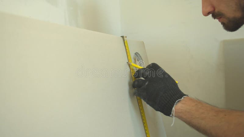 Repairman Measures a Length of the Wall Stock Photo - Image of ...