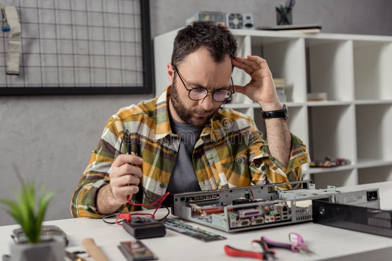 Multimeter And Broken Mobile Electronics At Repair Shop Stock Image ...