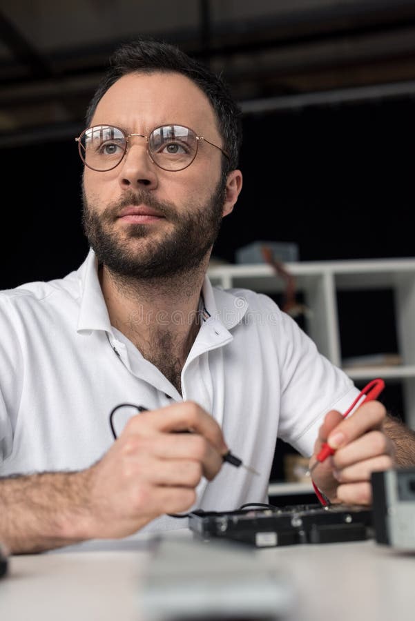 Man Using Multimeter while Testing Hard Disk Drive Stock Image - Image ...