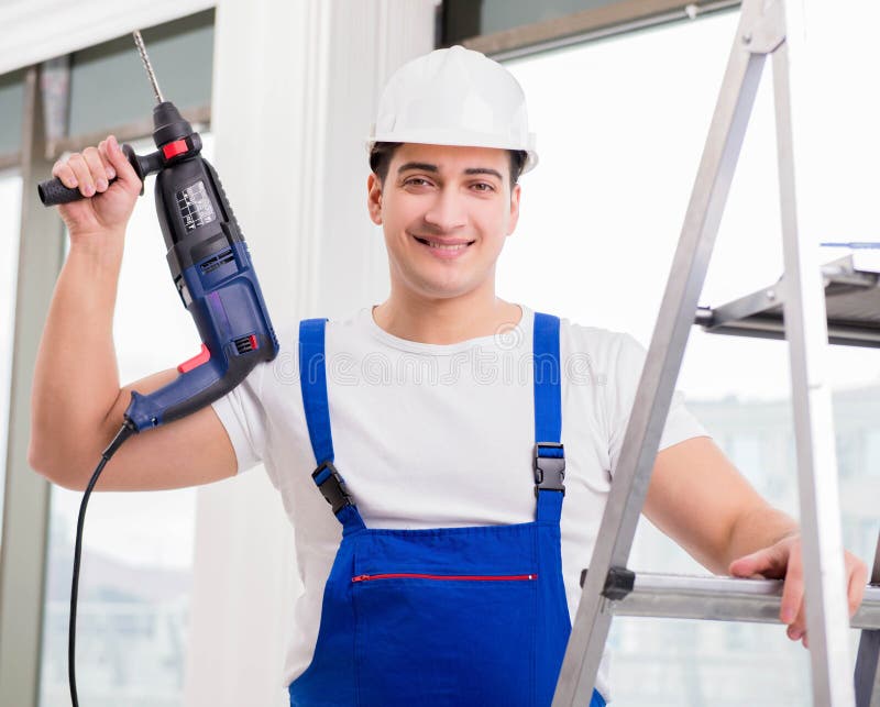Repairman Working with Power Drill in Workshop Stock Image - Image of ...