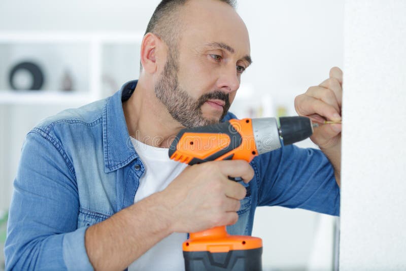 Repairman Working with Power Drill in Workshop Stock Photo - Image of ...