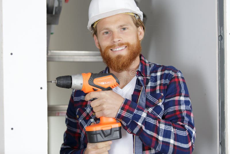 Repairman Working with Power Drill in Workshop Stock Photo - Image of ...