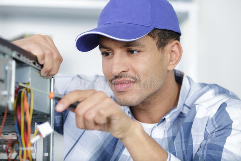 Repairman Working in Technical Support Fixing Computer Stock Image ...