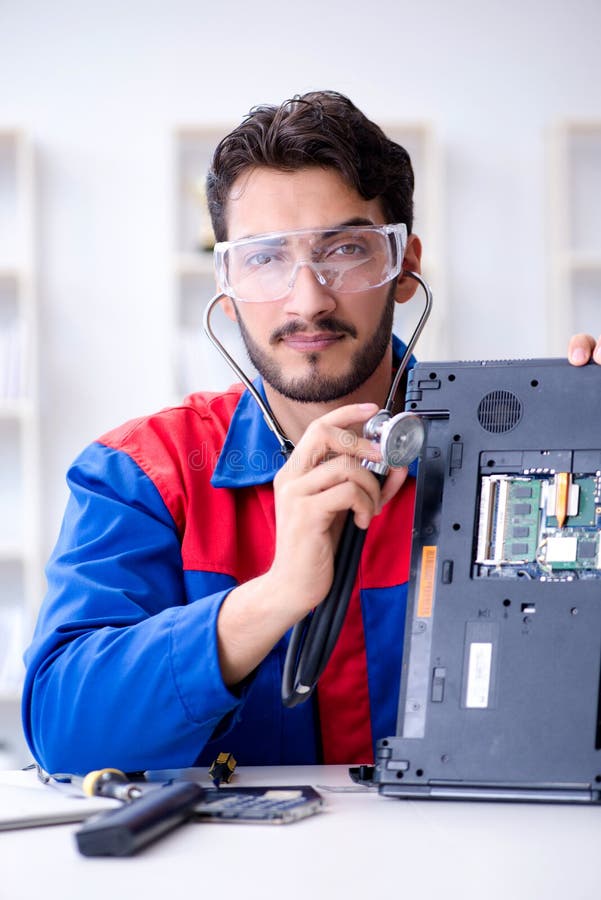 Repairman Working in Technical Support Fixing Computer Laptop Tr Stock ... Repairman Working in Technical Support Fixing Computer Laptop Tr Stock ...