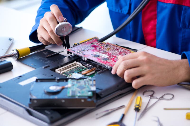 Repairman Working in Technical Support Fixing Computer Laptop Tr Stock ... Repairman Working in Technical Support Fixing Computer Laptop Tr Stock ...