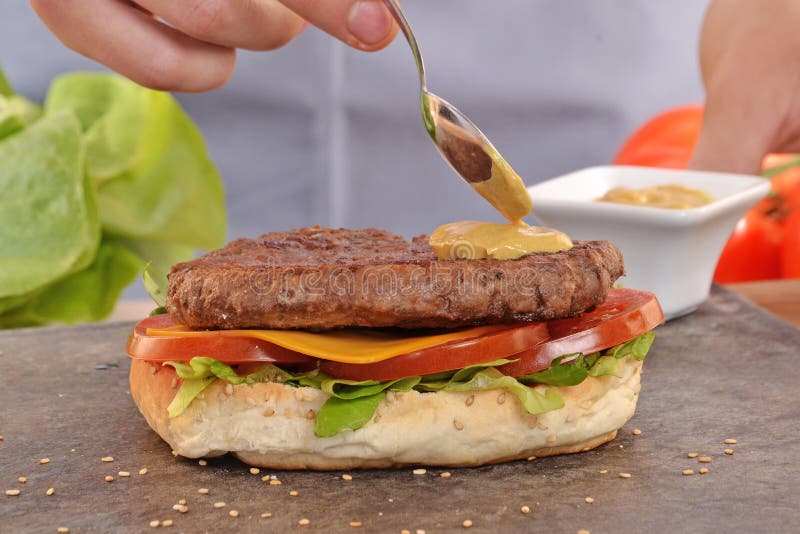 Reparing and Making Hamburger. Stock Image - Image of bread, cook: 56436319