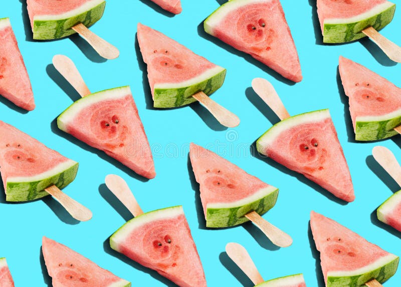 Repeating Pattern of Watermelon Popsicles on Bright Blue Background ...