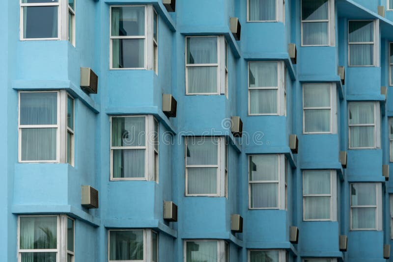 Repeating Pattern of Windows on a Blue Building Stock Image - Image of ...