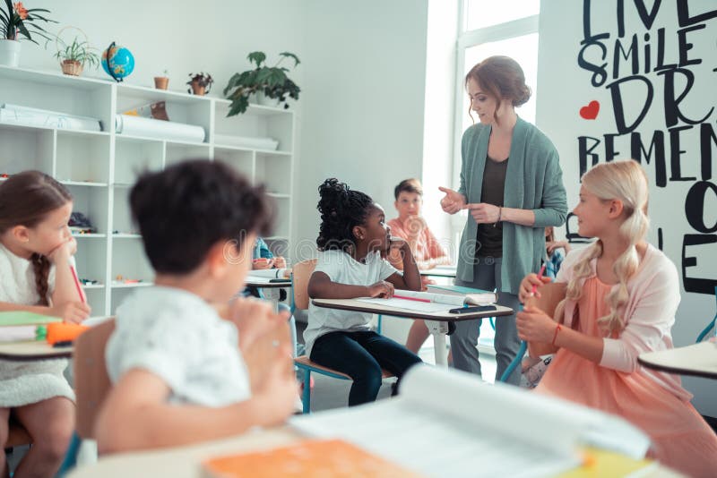 Teacher Slowly Explaining Meaning of the Exercise. Stock Image - Image ...
