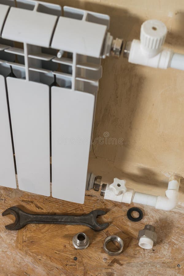 Replacement of a Broken Leaking Radiator in a Private Home Stock Image ...