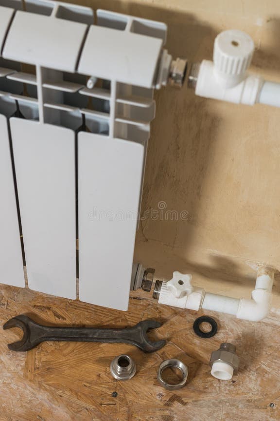Replacement of a Broken Leaking Radiator in a Private Home. Stock Image ...