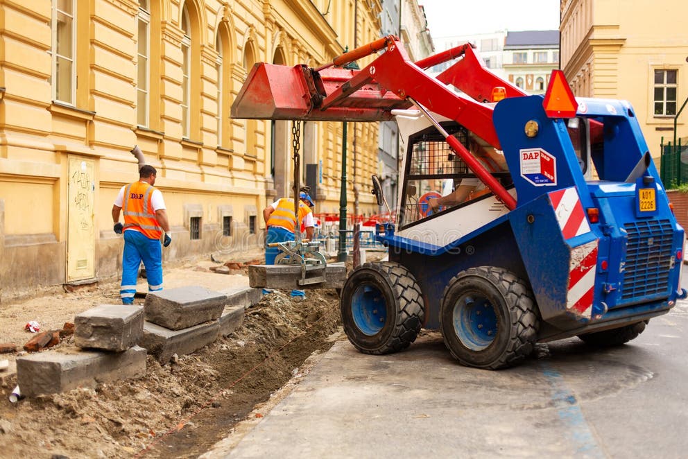 Replacement of Curbs and Repair of Sidewalks in the Old City. Workers ...