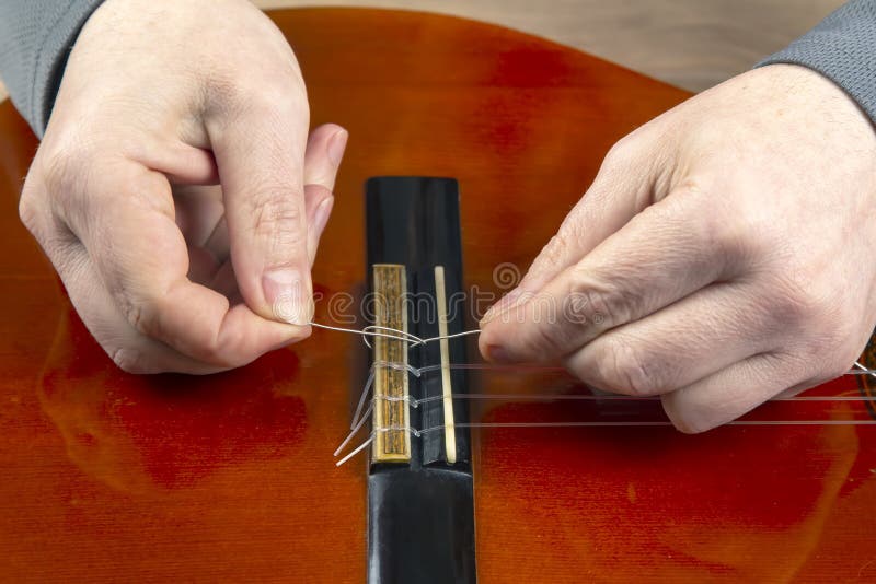 Replacement and Insertion of Nylon Strings in a Classical Guitar ...