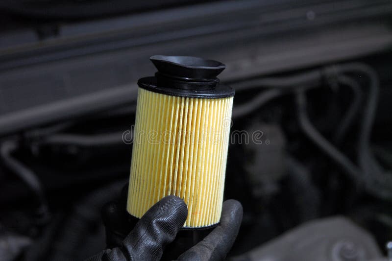 Replacement of oil filter stock photo. Image of filter - 102958126