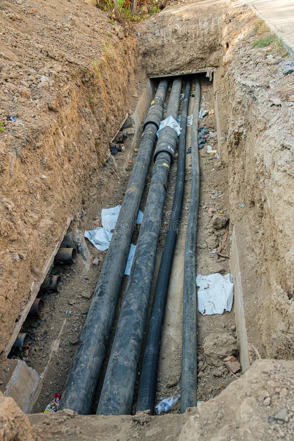 Replacement of Old Pipes with New Ones in the Pit Stock Photo - Image ...