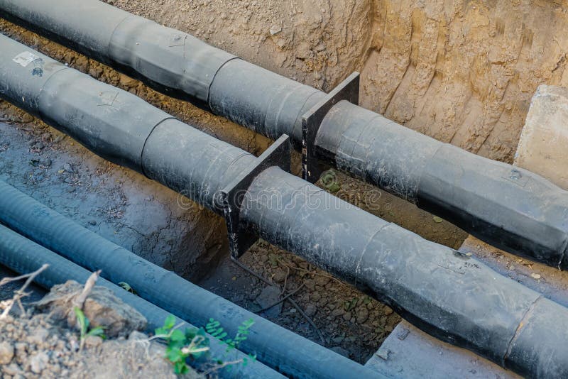 Replacement of Old Pipes with New Ones in the Pit Stock Image - Image ...
