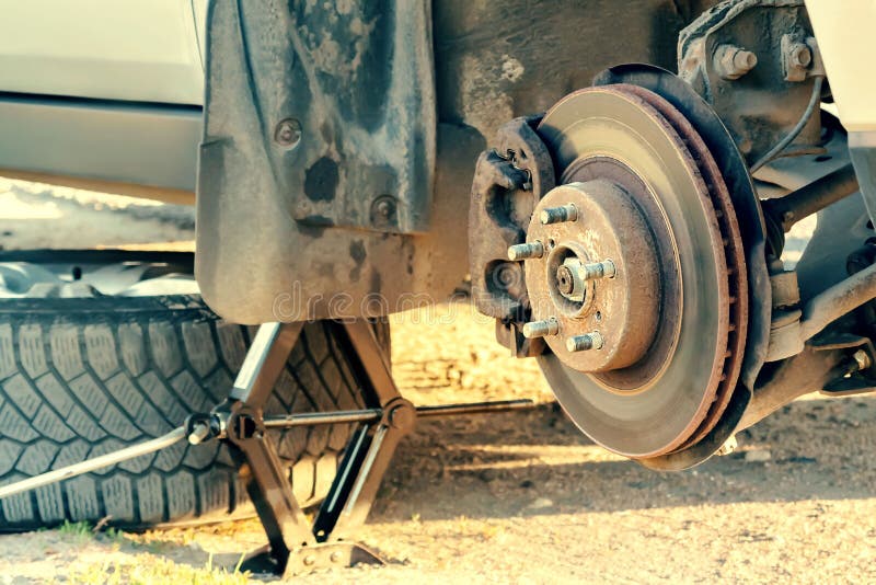 Replacement Wheels on the Highway, the Car is Jacked, the Wheel is ...