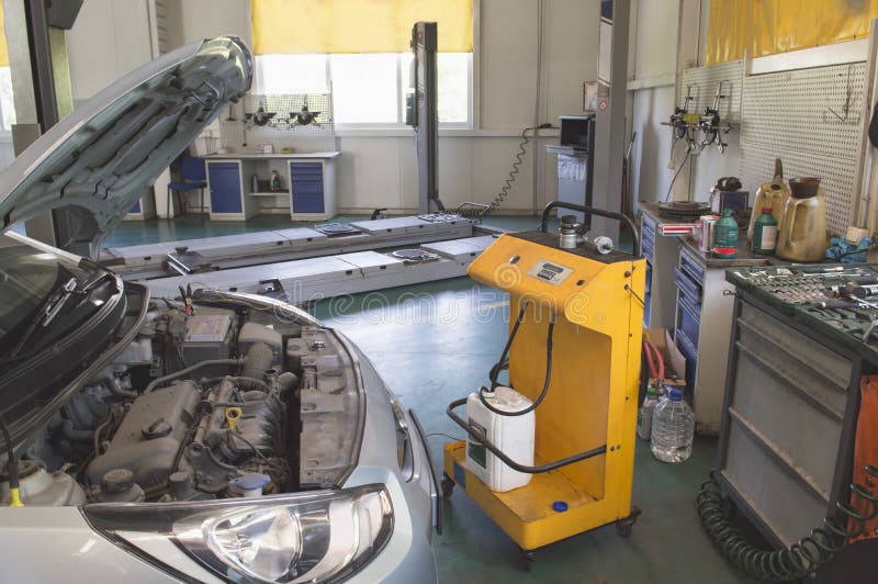 Replacing the Coolant on the Car Stock Photo - Image of cart, garage ...