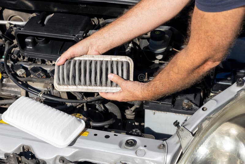 Replacing the Dirty Engine Air Filter for a Car Stock Photo - Image of ...