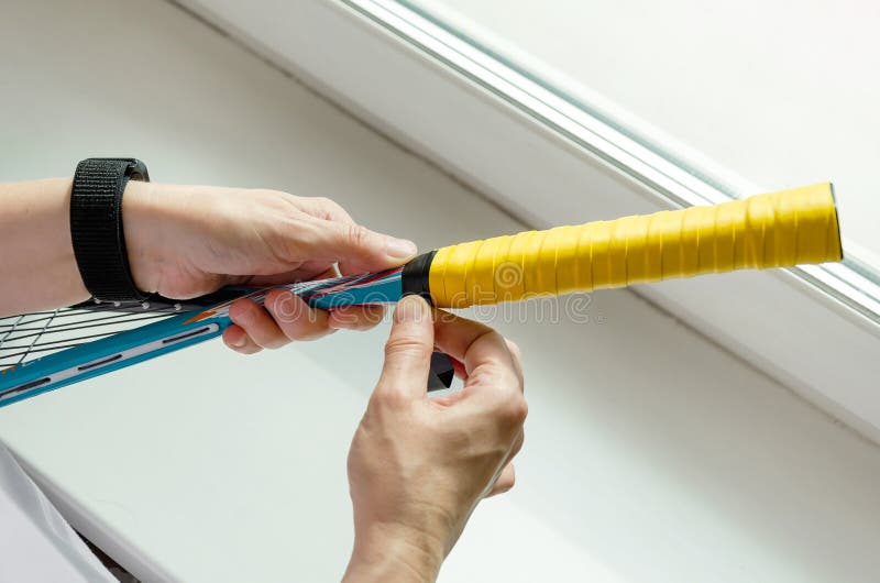 Replacing Grip on Racket Handle with Yellow Tape Stock Image - Image of ...