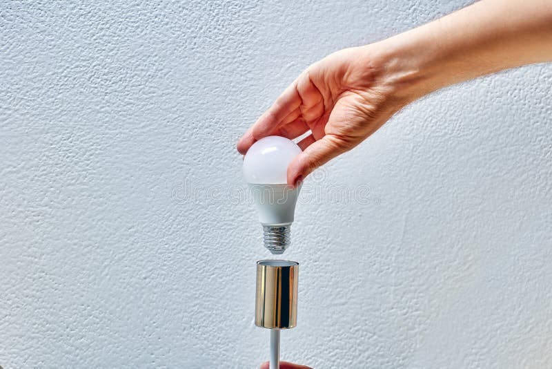 Replacing an LED Light Bulb in Household Lighting Fixture for Home ...