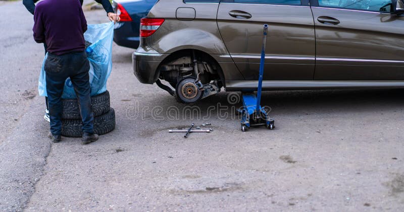 Replacing the Rear Wheel of a Car Stock Photo - Image of steel, season ...