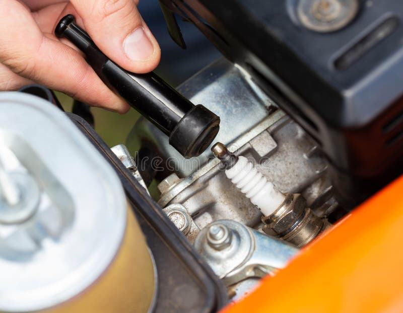 Spark Plug in the Engine Cylinder of a Walk-behind Tractor. Maintenance ...