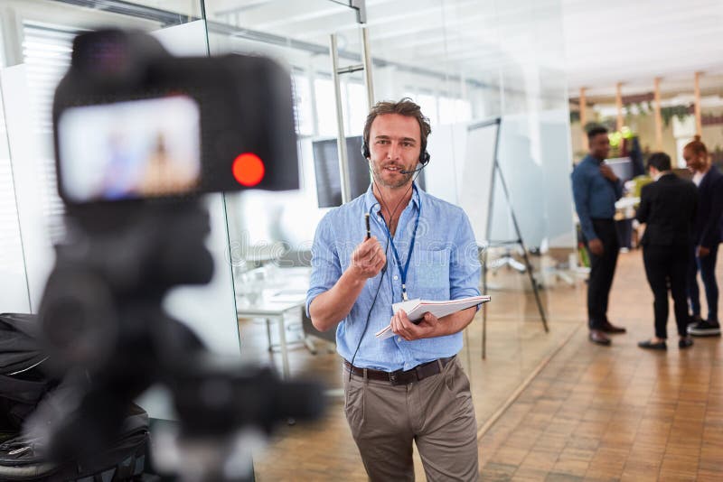 Reporter with Headset in Front of Video Camera with News Stock Photo ...