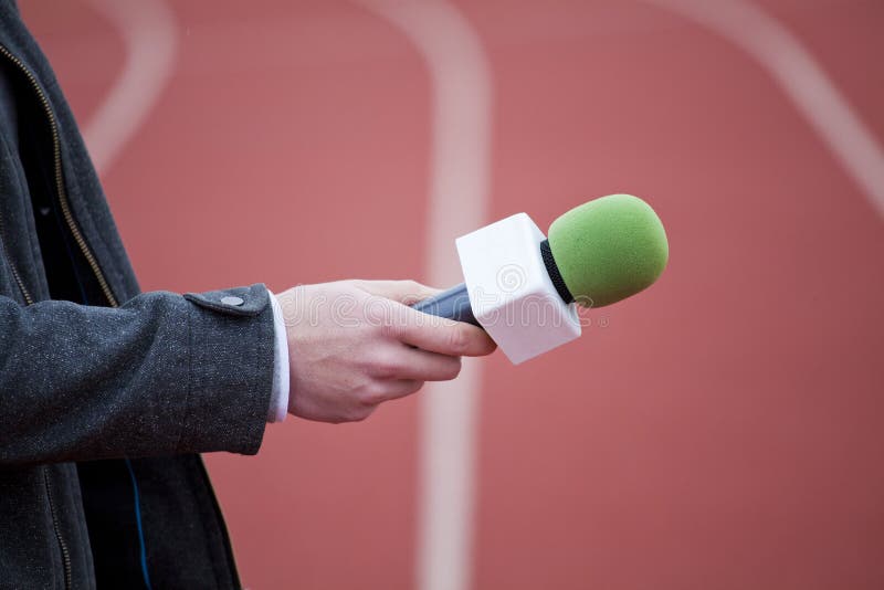 Reporter Holding Microphone Stock Image - Image of microphone, black ...