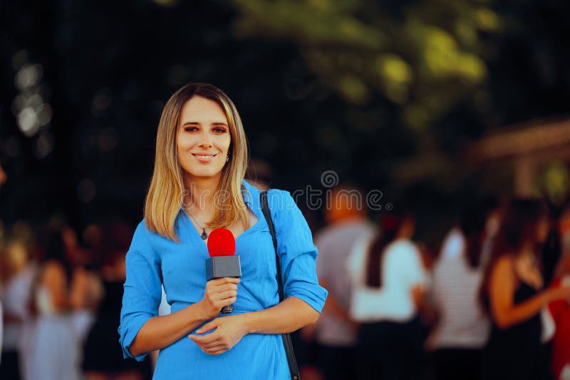 Reporter Holding a Microphone in Outdoors Broadcasting Event Stock ...