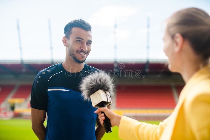 Reporter Interviewing Football Player in a Stadium Stock Image - Image ...