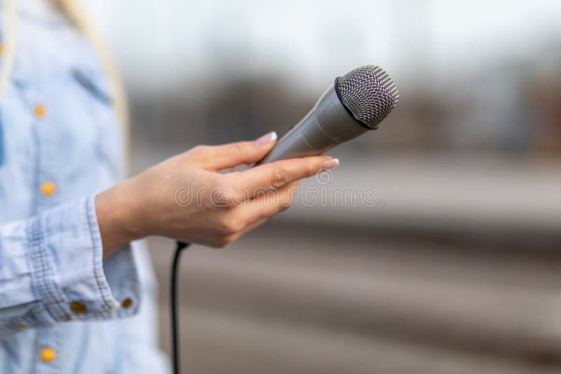 Reporter on the Spot, Holding Microphone in Hand Stock Image - Image of ...