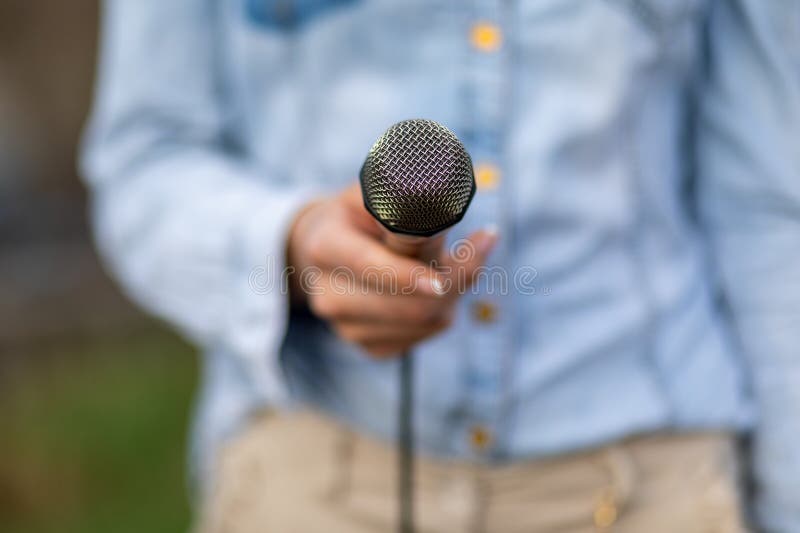 Reporter on the Spot, Holding Microphone in Hand Stock Image - Image of ...