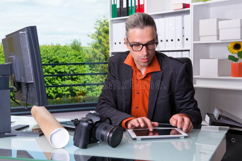 Reporter Working in Editorial Office with Computer and Camera Stock ...