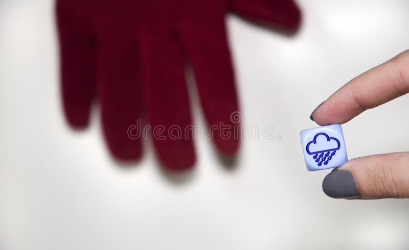 Representation of the Rain with a Dice and a Glove in the Background ...