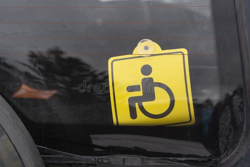 Representation of a Yellow Wheelchair Accessibility Sign Displayed on a ...