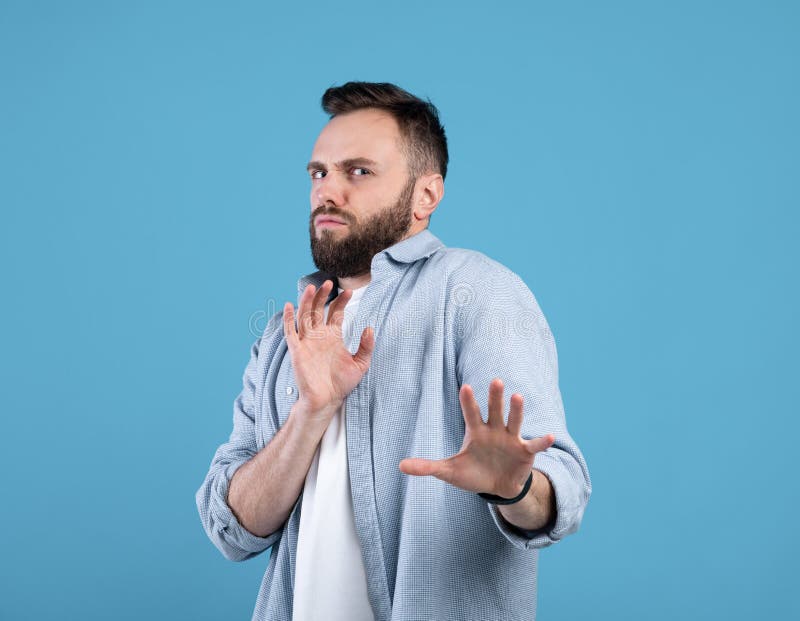 Repulsed Millennial Guy Rejecting Something, Making STOP Gesture Over ...